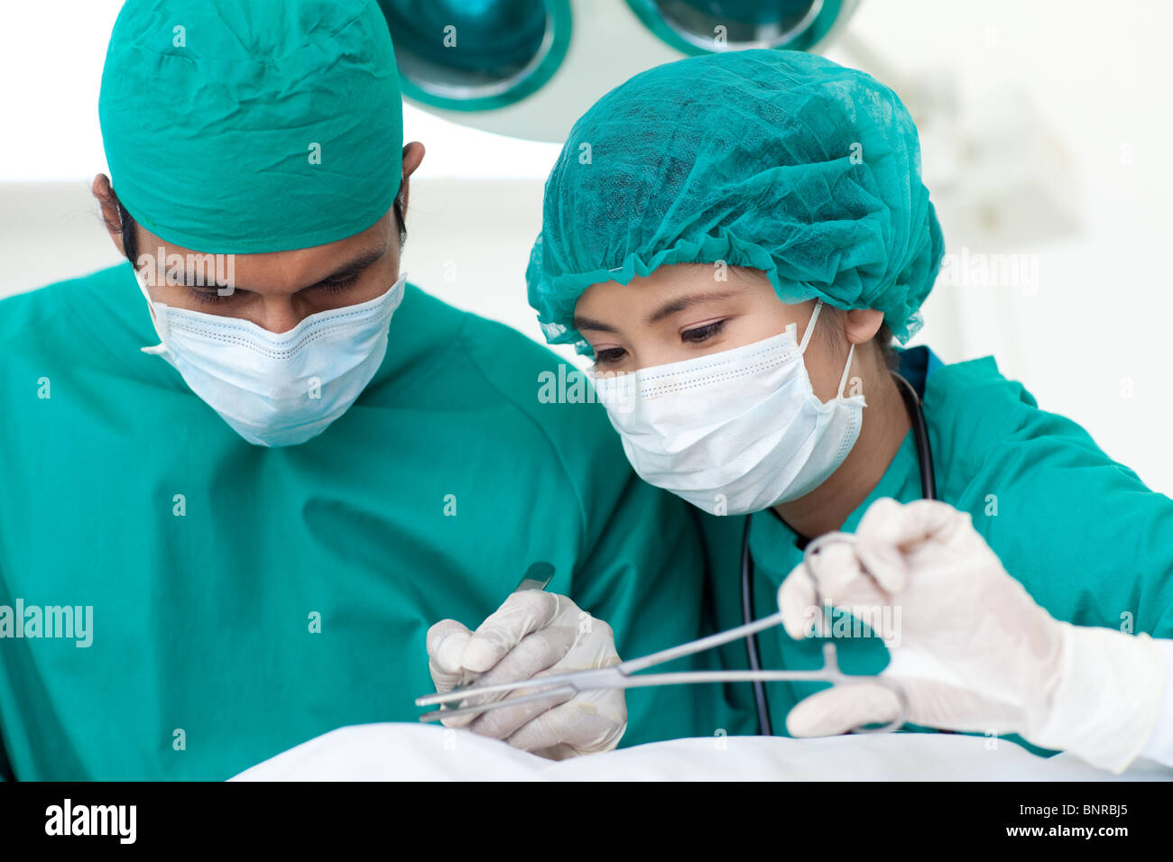 Portrait of two surgeons in operative room Stock Photo - Alamy