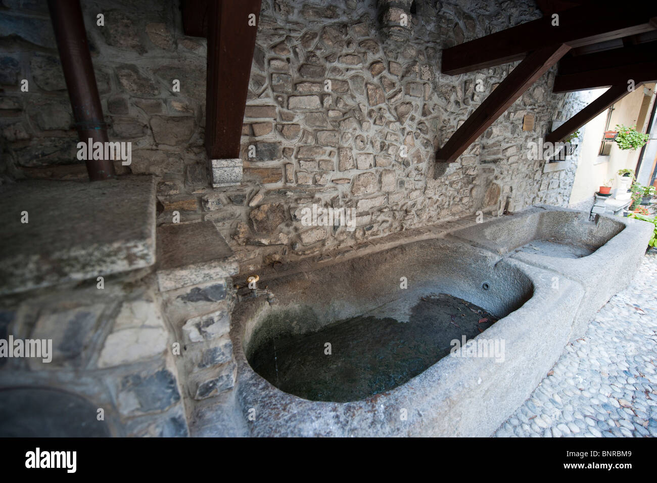 Old fountain and stone wash basins in Civenna Lombardy Italy Stock ...