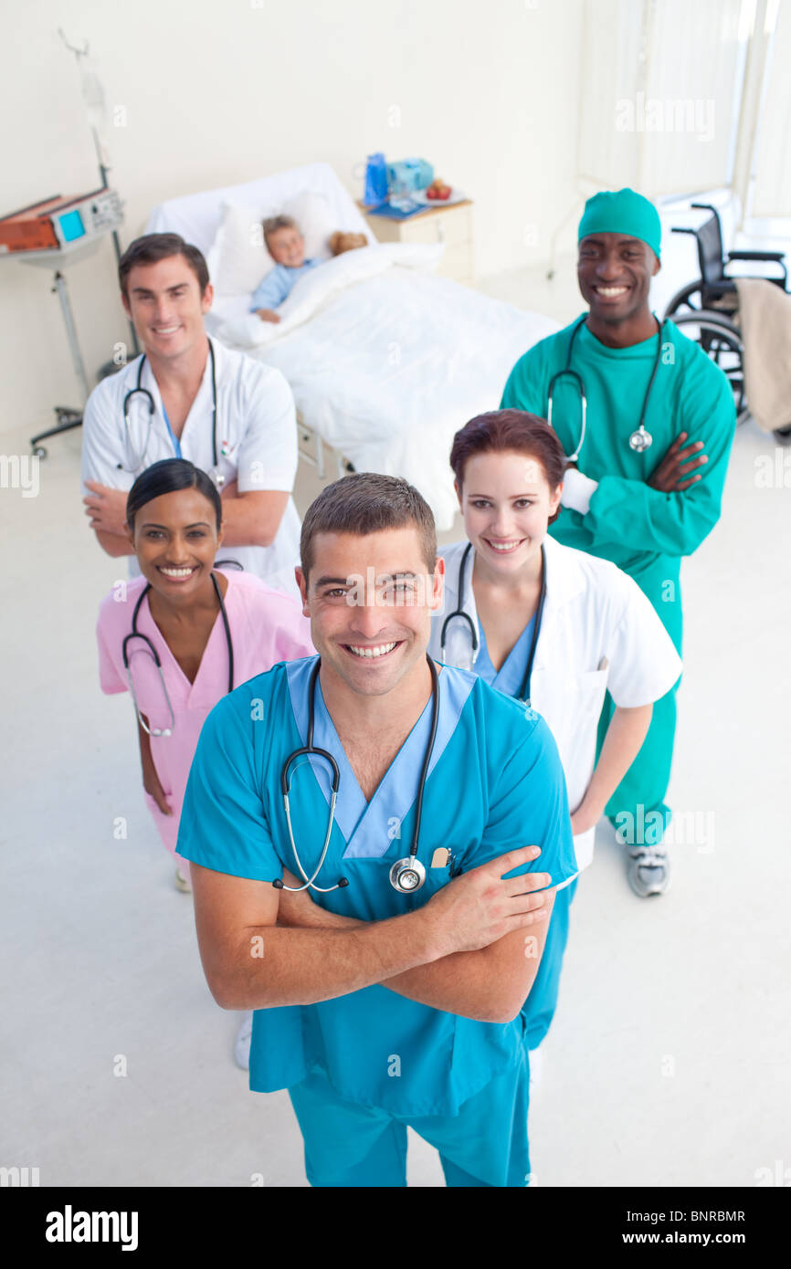 High angle of medical team with a child patient Stock Photo - Alamy