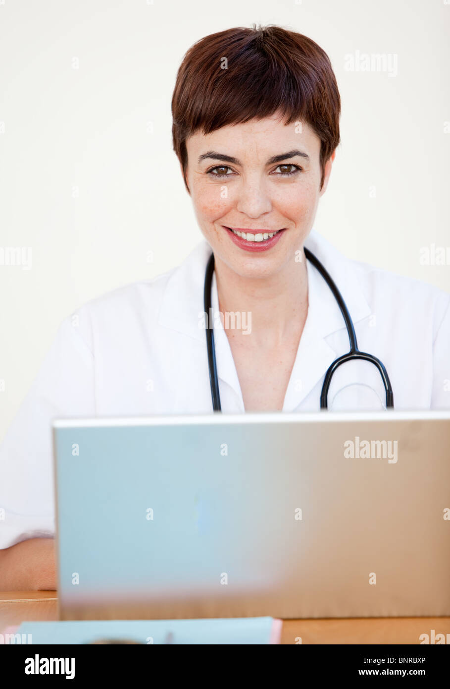 Doctor sitting at desk in Hospital Stock Photo - Alamy