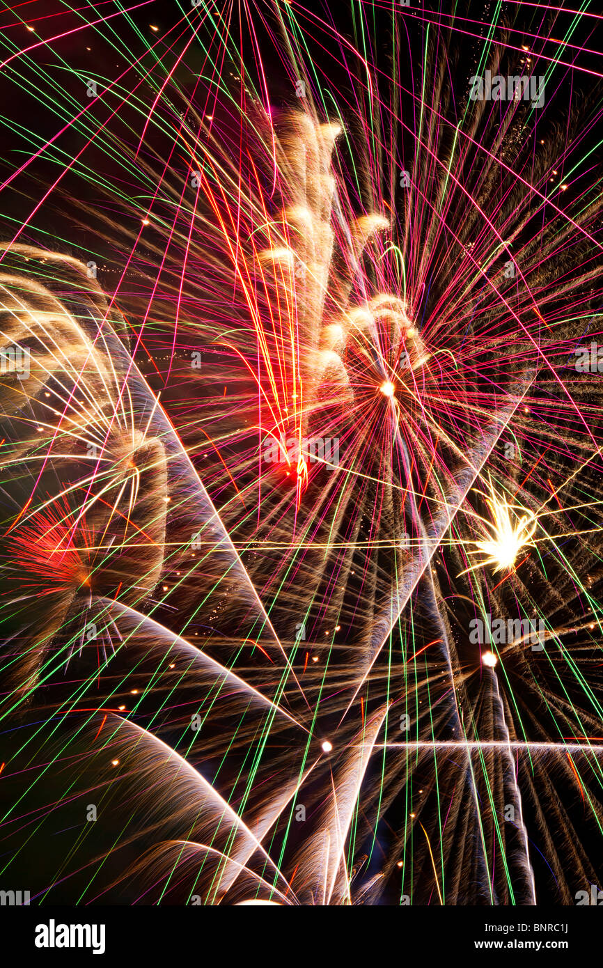 Fireworks exploding in night sky, pyrotechnics Stock Photo - Alamy