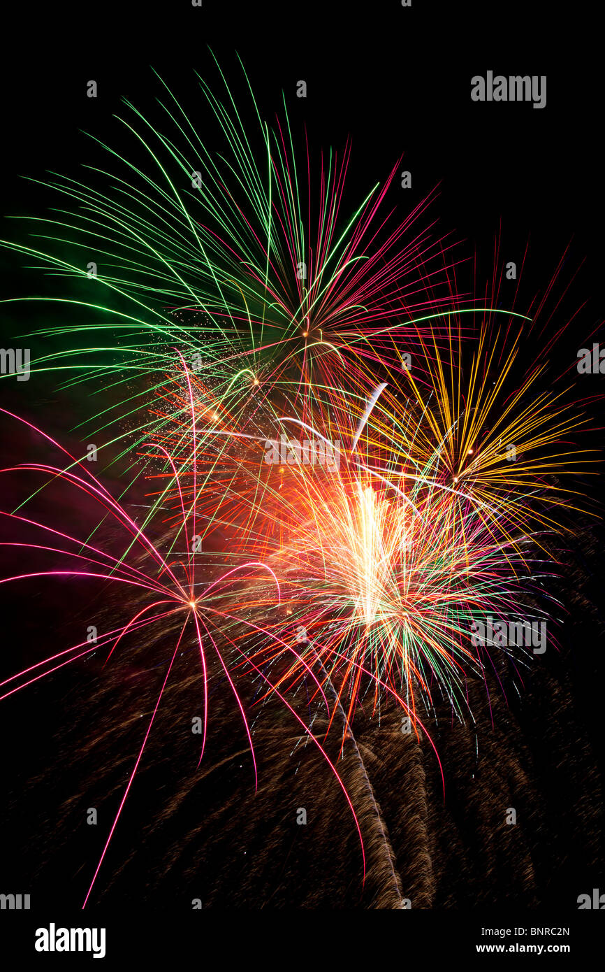 Fireworks exploding in night sky, pyrotechnics Stock Photo - Alamy