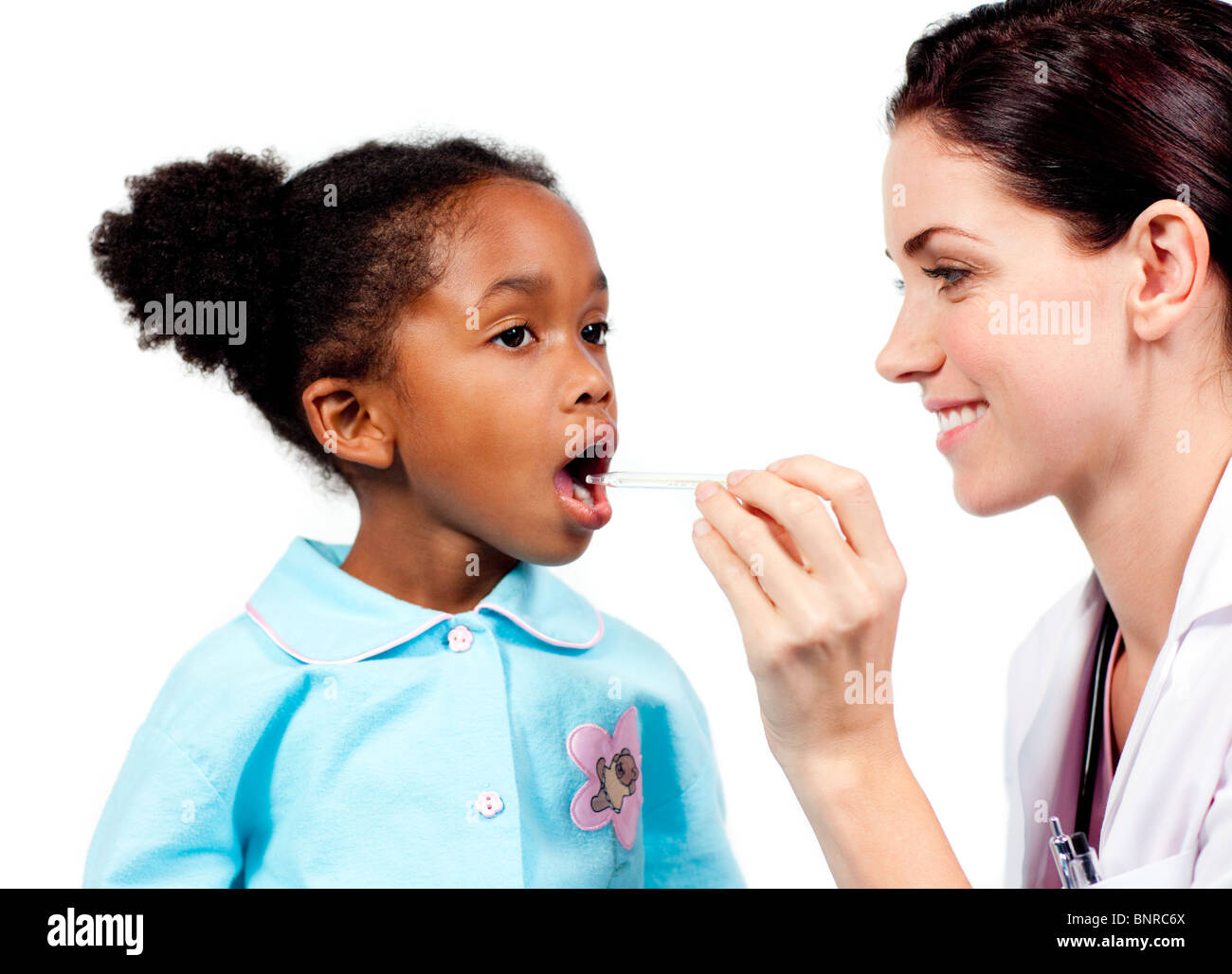 Smiling doctor taking little girl's temperature Stock Photo - Alamy