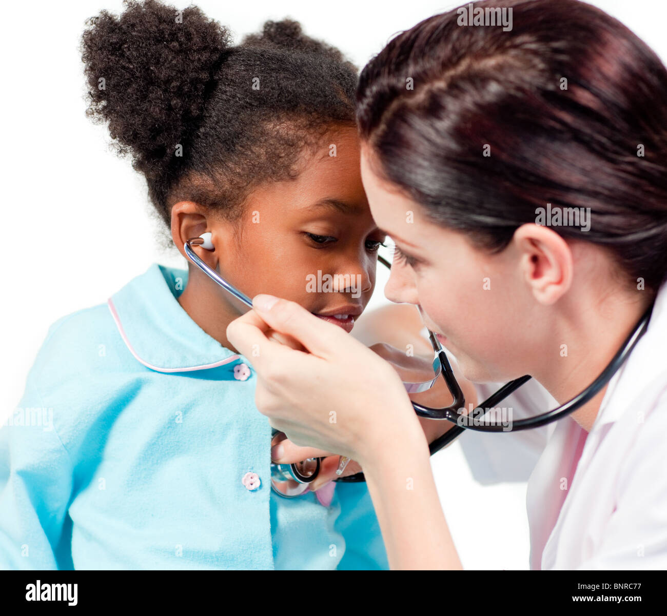 Female doctor and her patient playing with a stethoscope Stock Photo ...