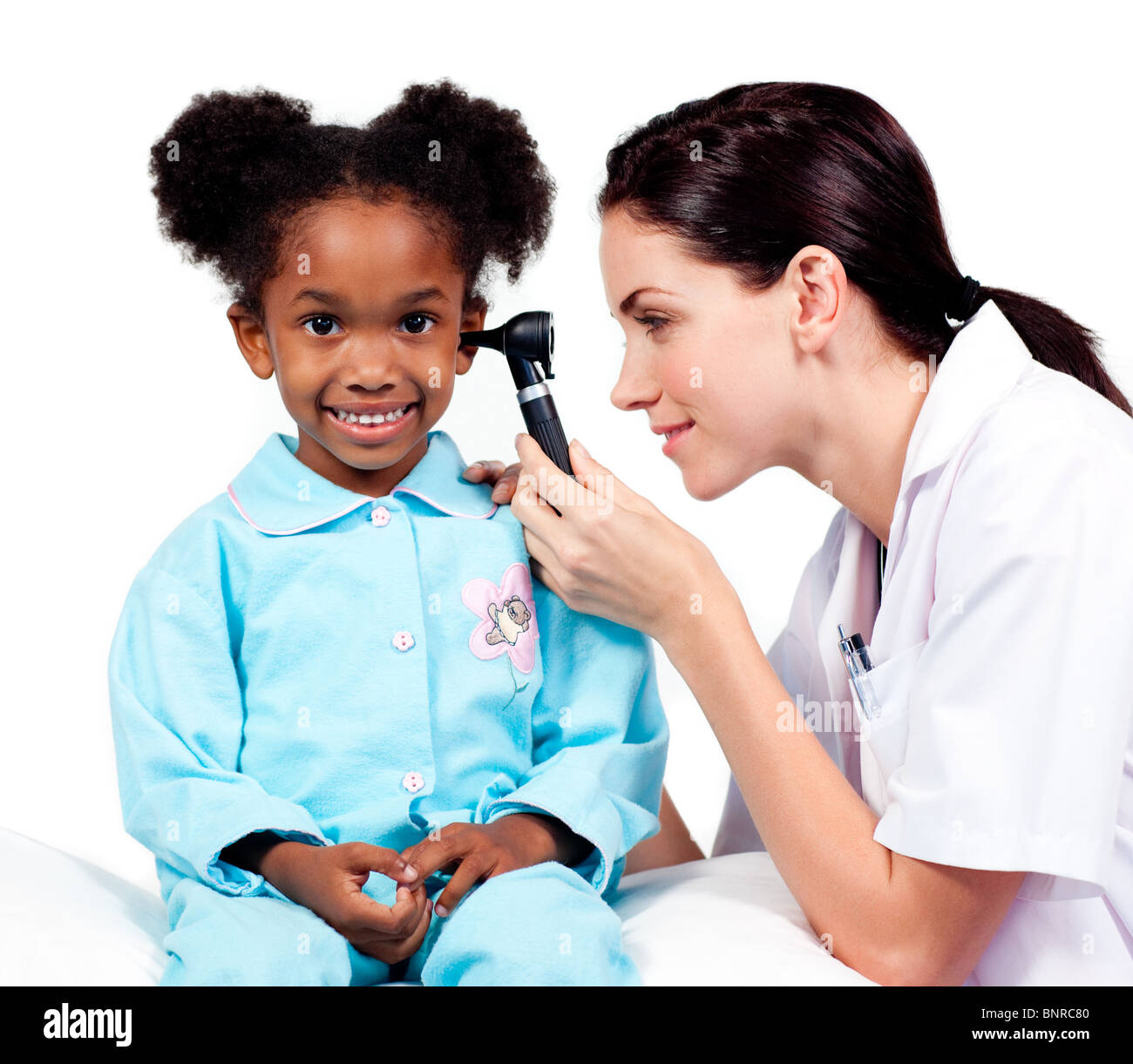 Female doctor checking her patient's ears Stock Photo - Alamy