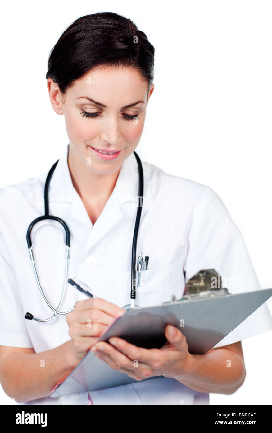 Pretty surgeon writting a report Stock Photo - Alamy
