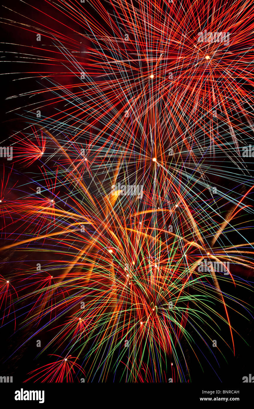 Fireworks exploding in night sky, pyrotechnics Stock Photo - Alamy