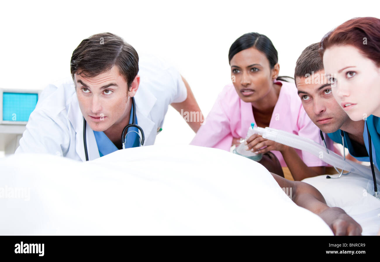 Medical team during an operation Stock Photo - Alamy