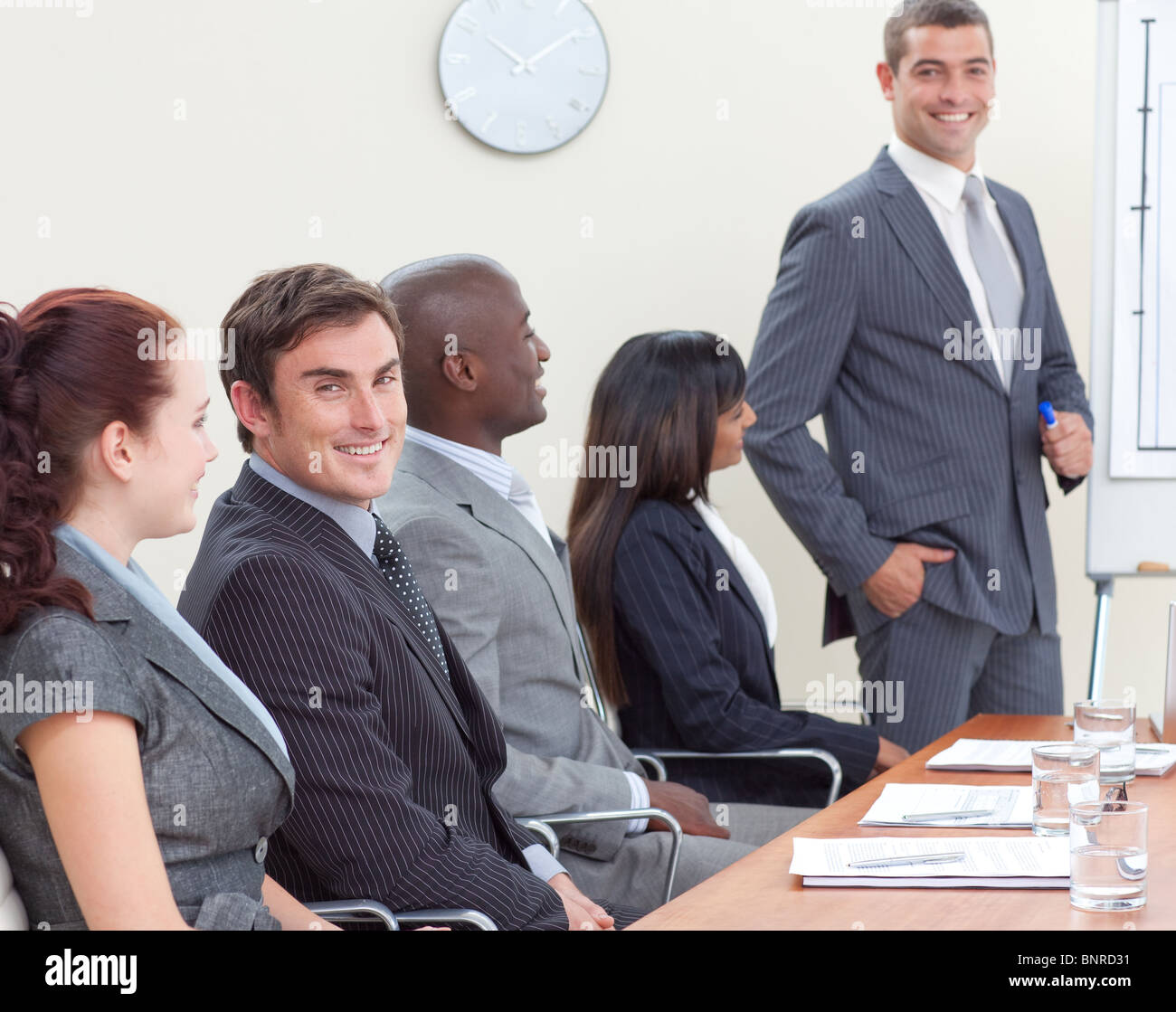 Business team in a meeting listening to a colleague Stock Photo - Alamy