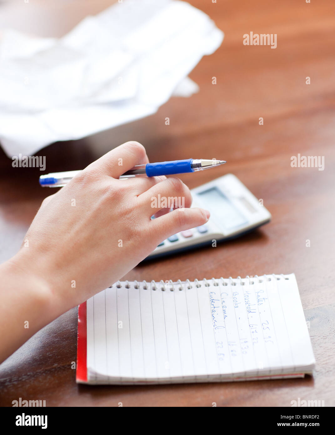 Close-up of a woman paying her bills Stock Photo - Alamy