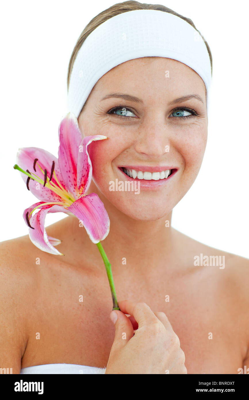 Pretty woman smelling a flower Stock Photo - Alamy
