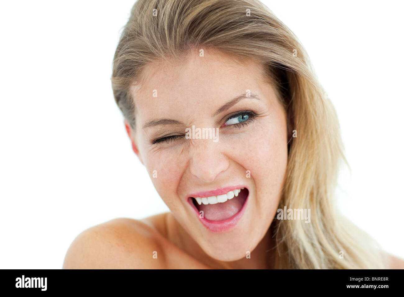 Cheerful Woman winking Stock Photo - Alamy
