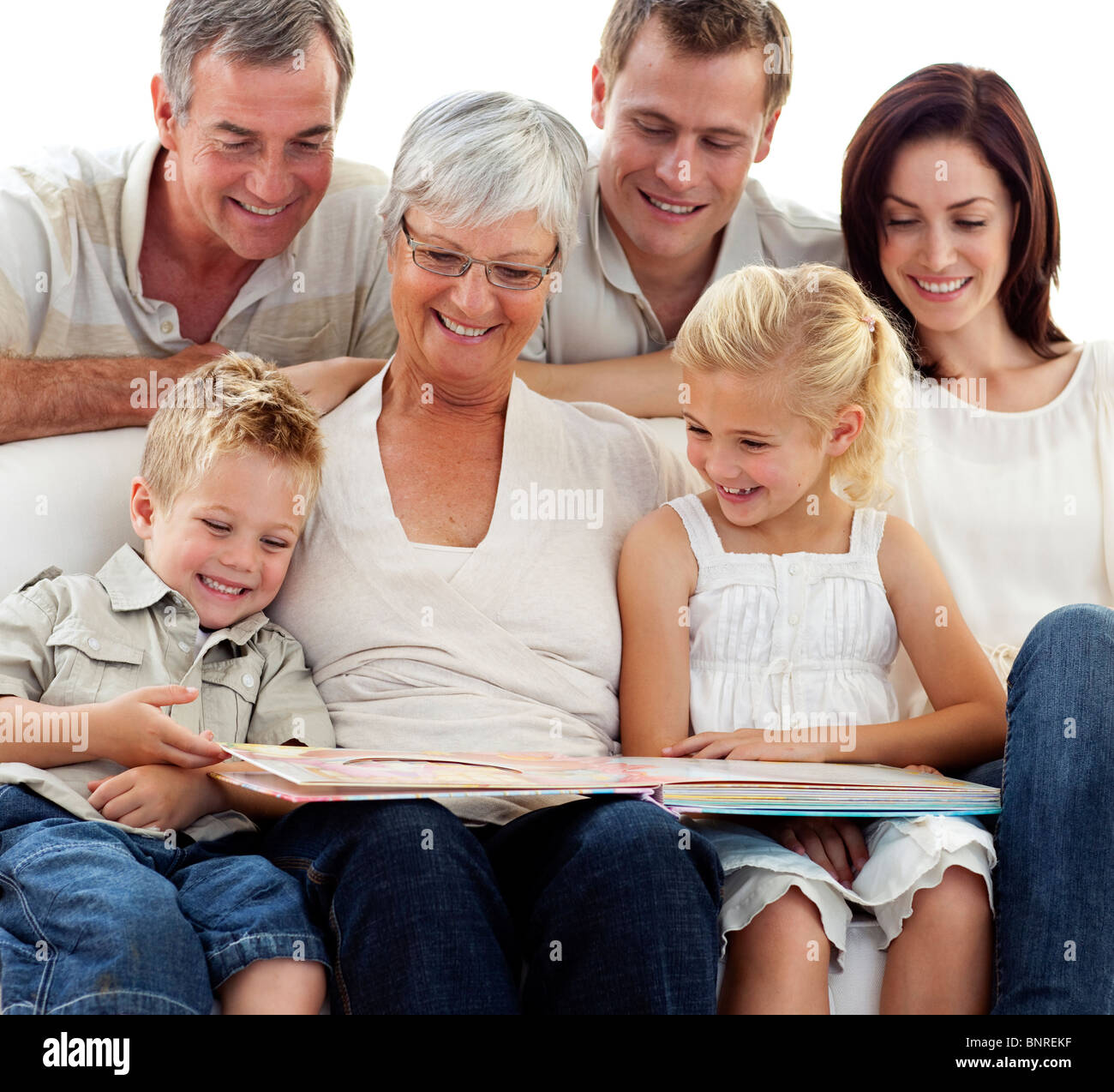 Happy family observing photograph album Stock Photo - Alamy