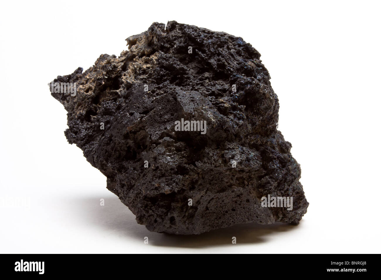 Abstract chunk of Lava Rock from low perspective isolated against white ...