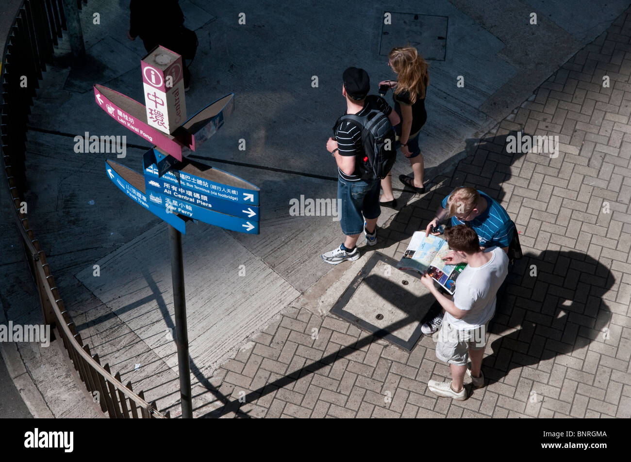 Tourists finding their way in the centre of Hong Kong Stock Photo - Alamy