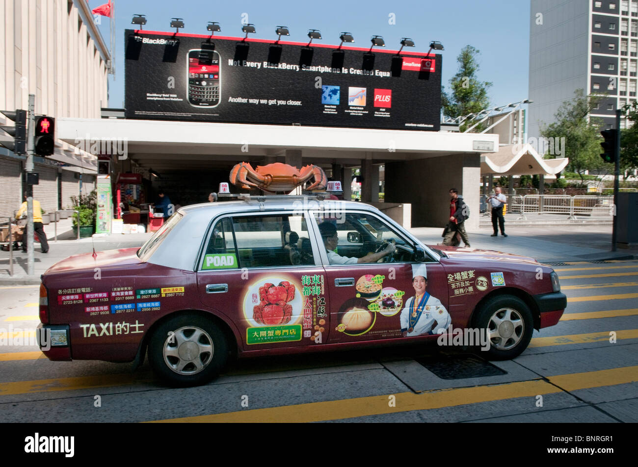 Taxi with restaurant advertisement in the centre of Hong Kong Stock ...