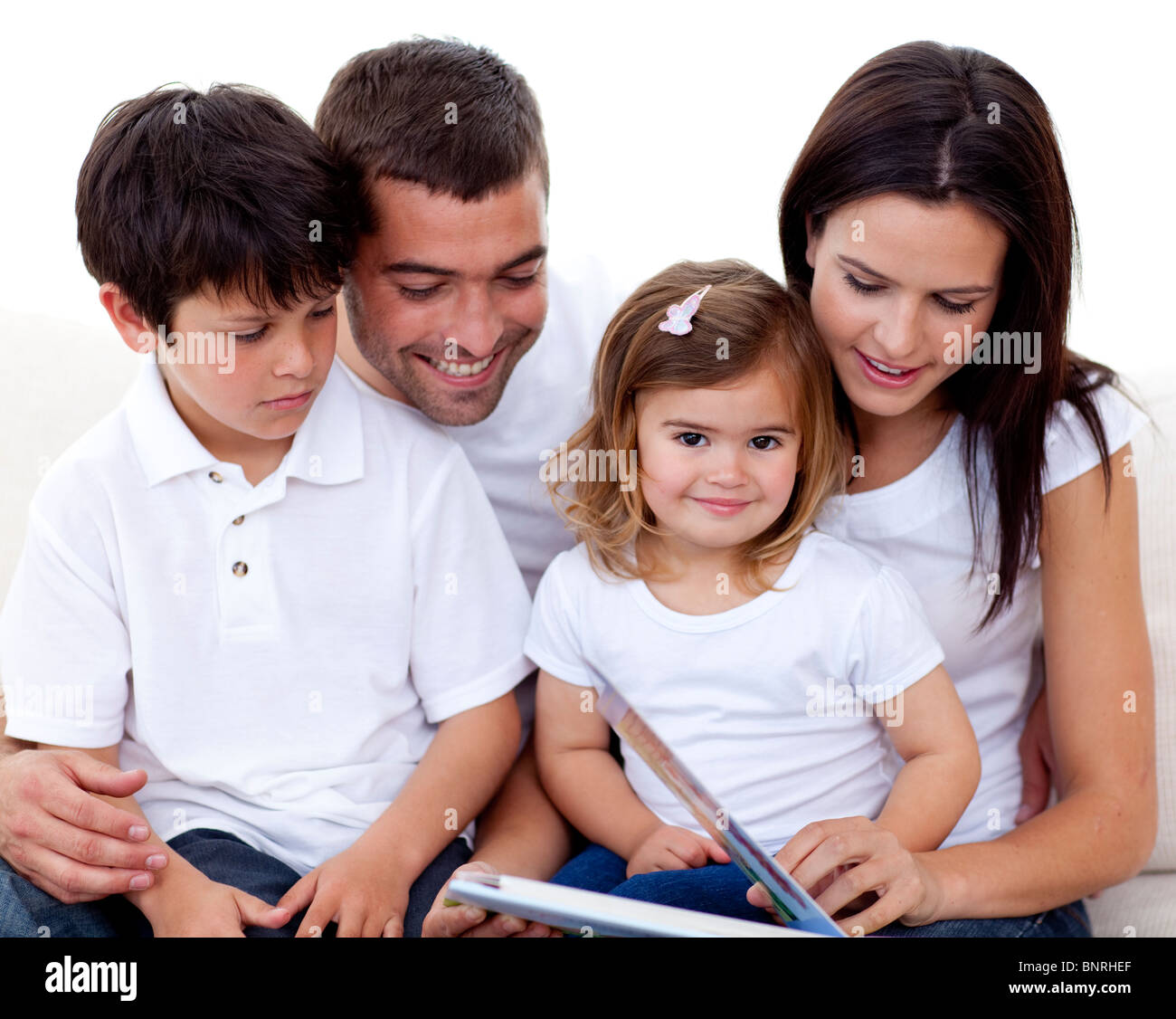 Portrait of a family reading a book Stock Photo - Alamy