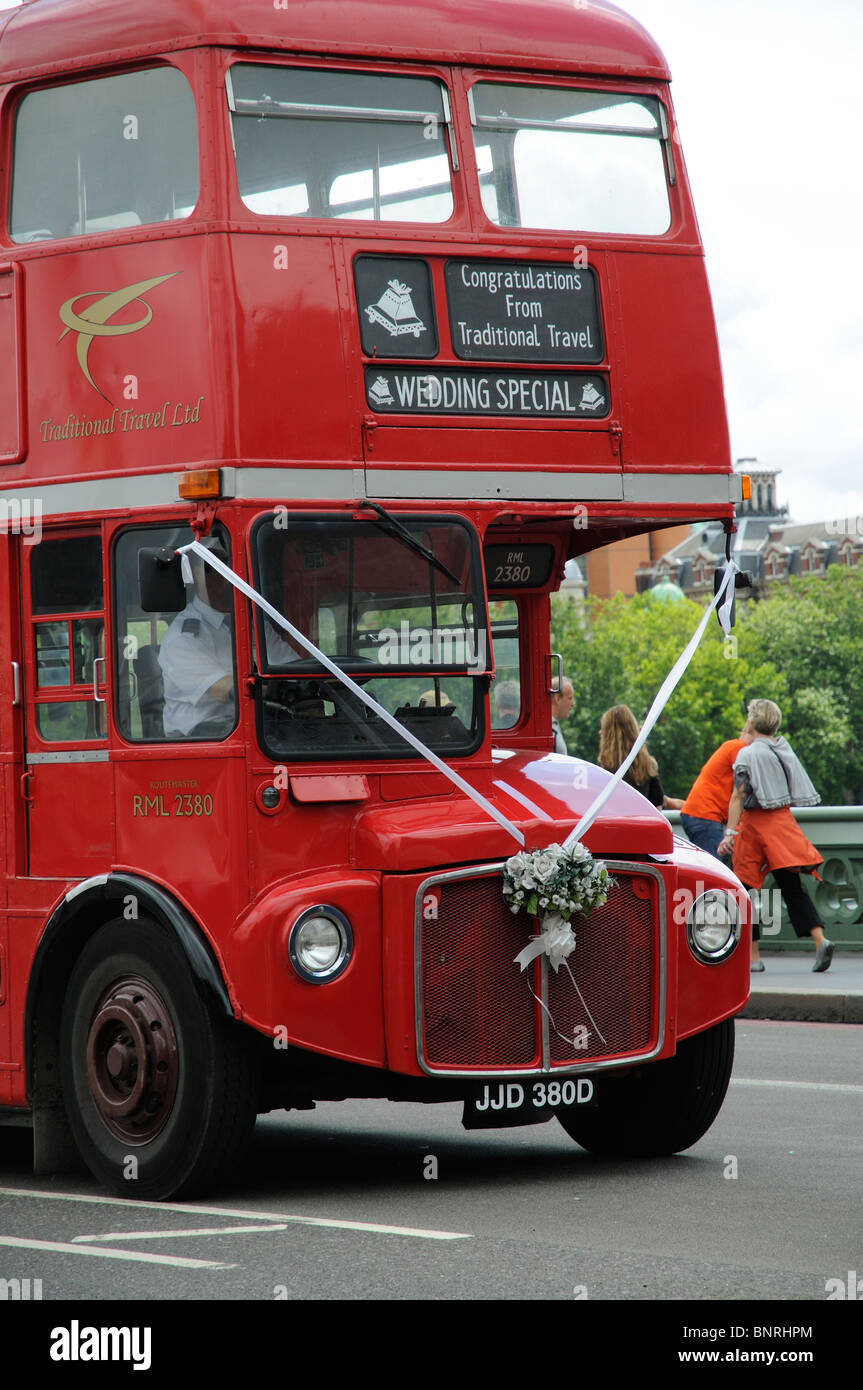 Wedding special an old red London Routemaster bus with white ribbons ...