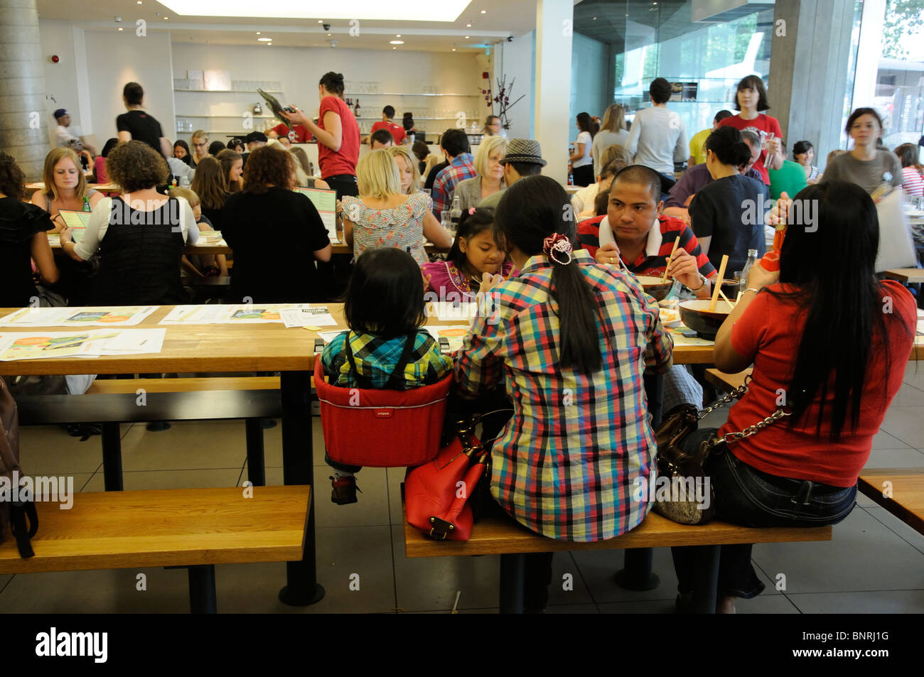 Customers dining in a fastfood restaurant Stock Photo - Alamy
