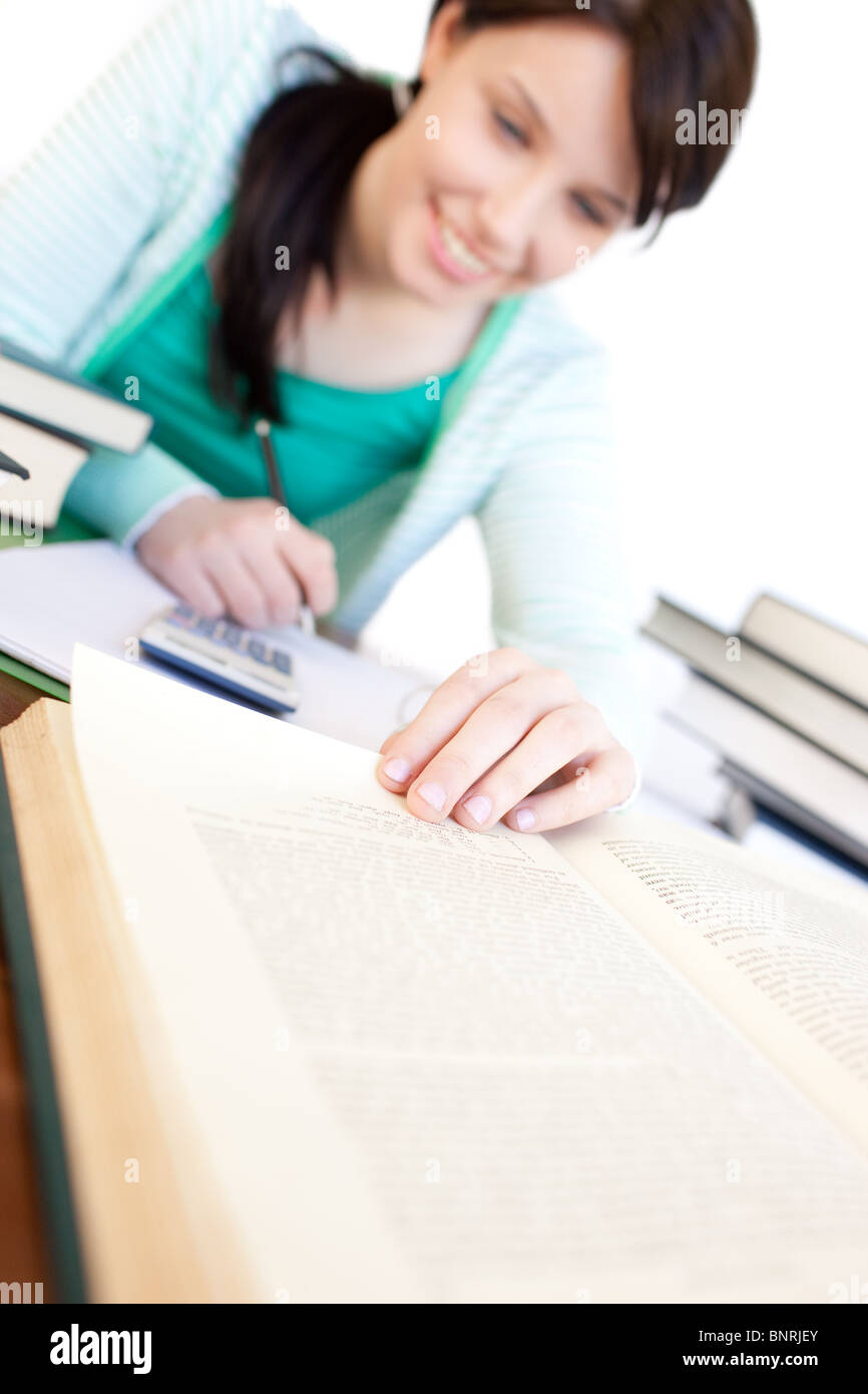 Cheerful student doing her homework on a desk Stock Photo - Alamy