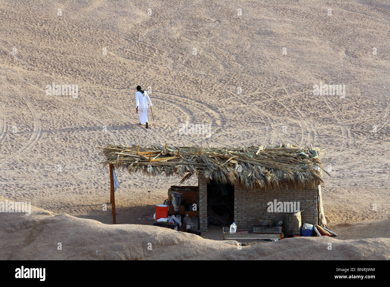 Man walking away from shack in Sharm el Sheikh Egypt Stock Photo - Alamy