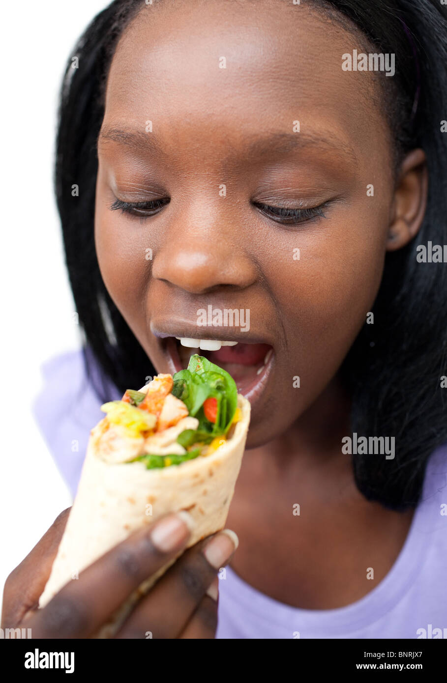 Woman eating a wrap Stock Photo - Alamy