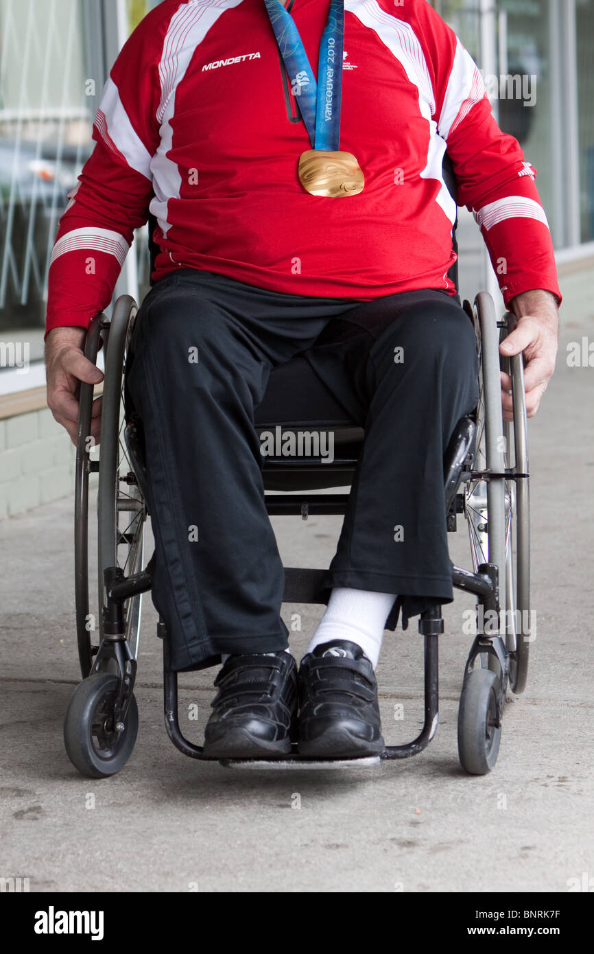 A Canadian Paralympian shows of his gold medal from the 2010 Winter ...