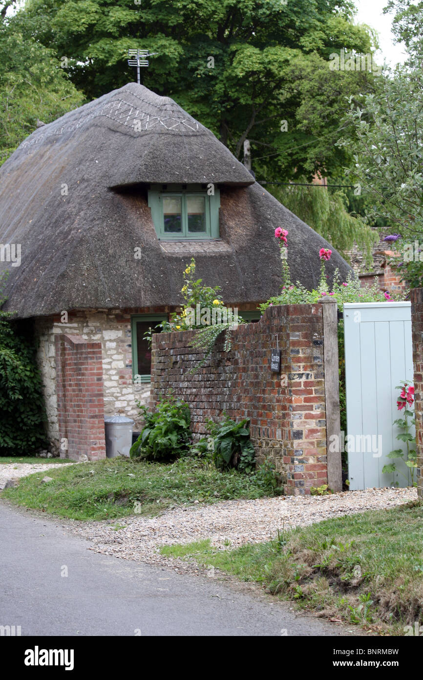 Old thatched cottage in small hi-res stock photography and images - Alamy