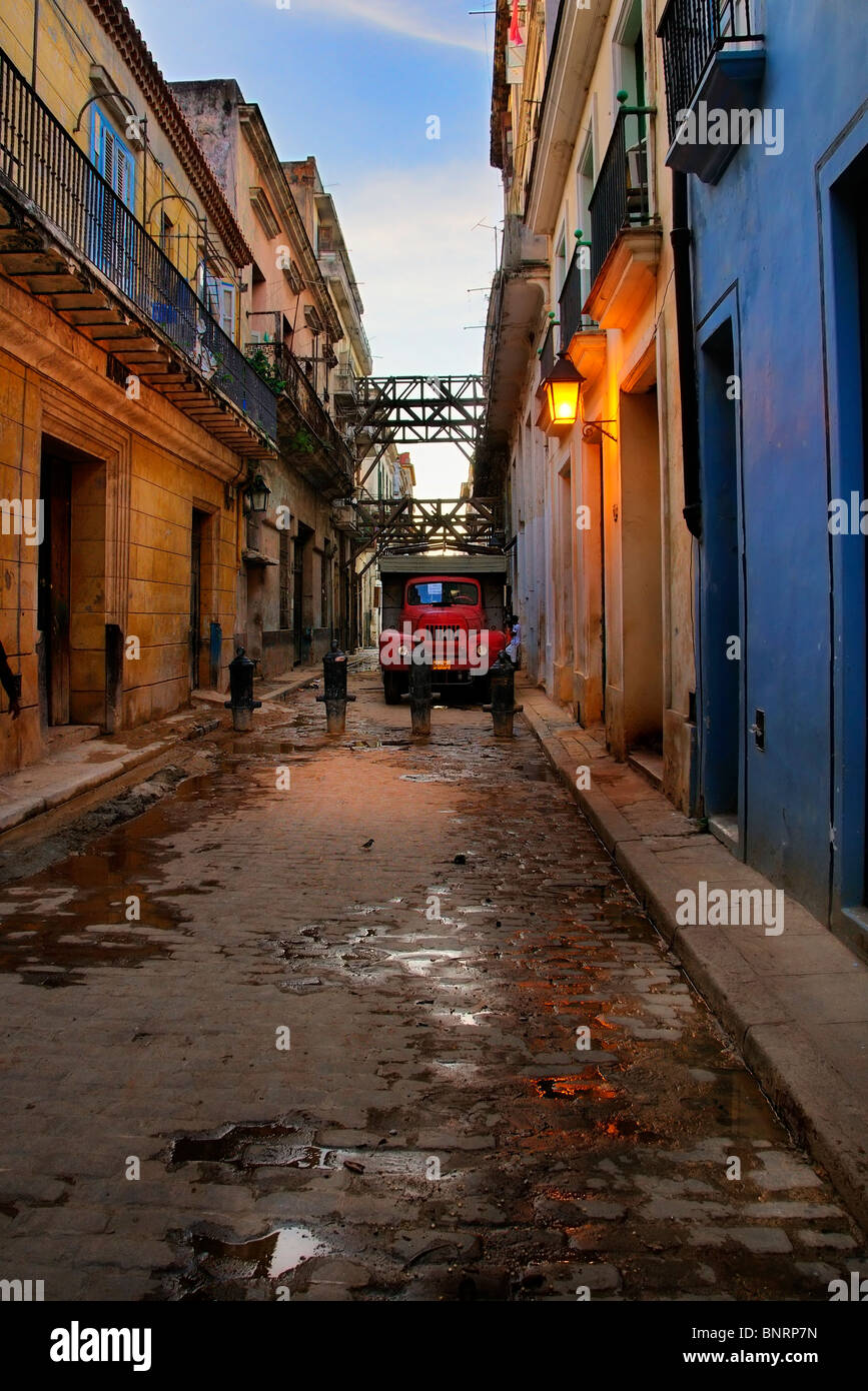 View of messy street of havana with old truck parked in the background ...