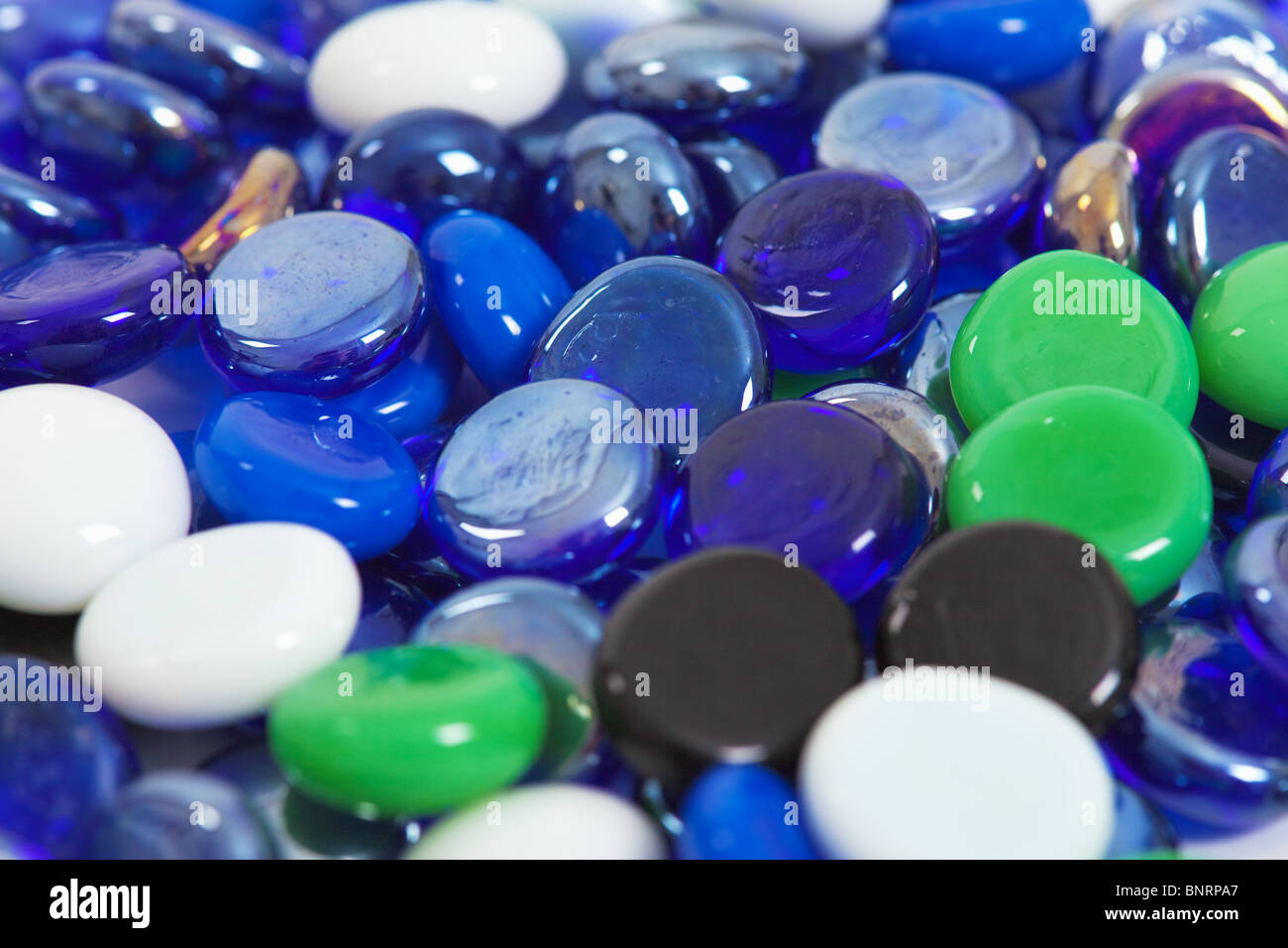 Scattering glass stones of different colors - background Stock Photo ...