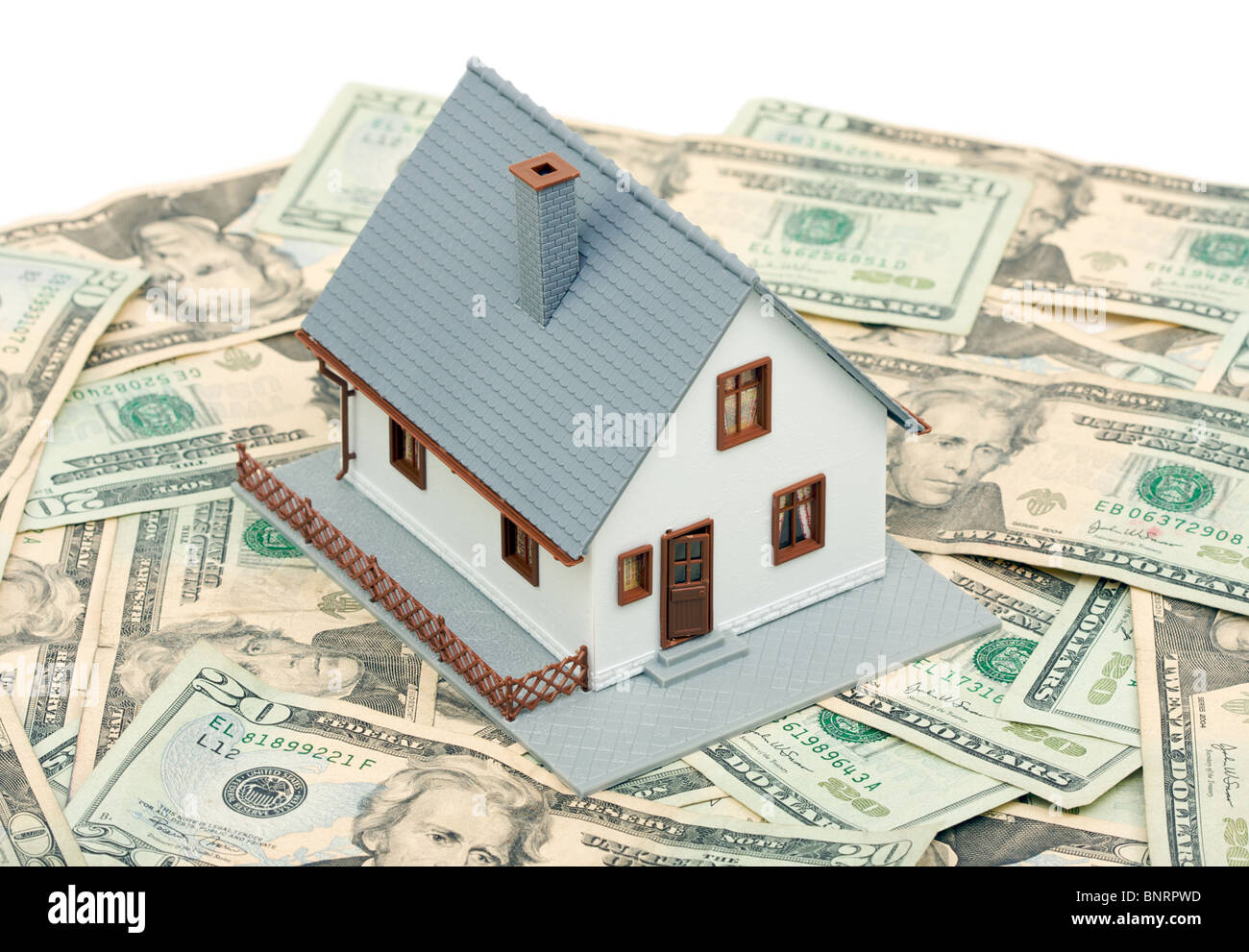 Home and Money Isolated on a White Background Stock Photo - Alamy