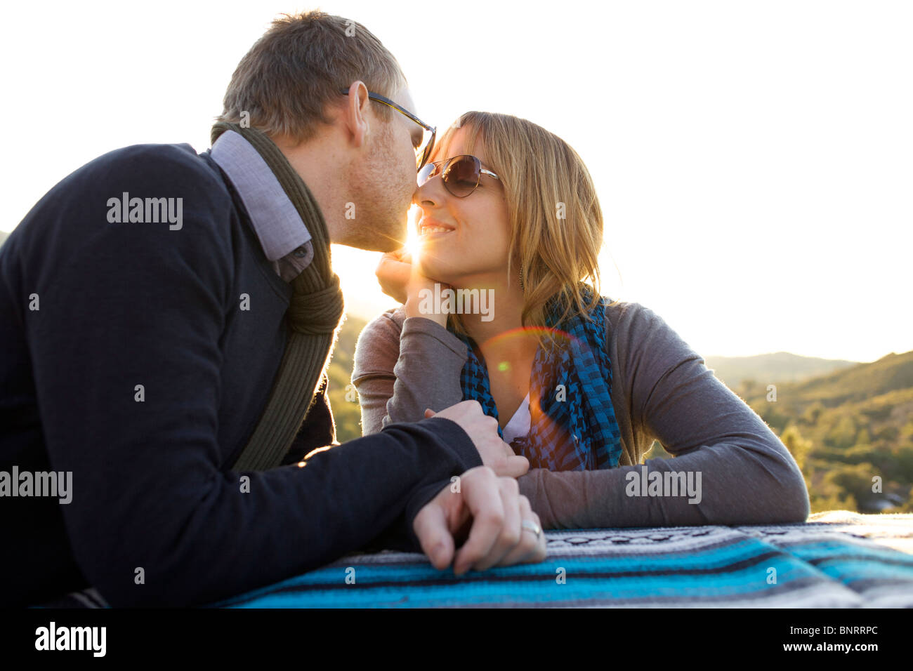 Couple approach each other to kiss on the side of the road Stock Photo ...