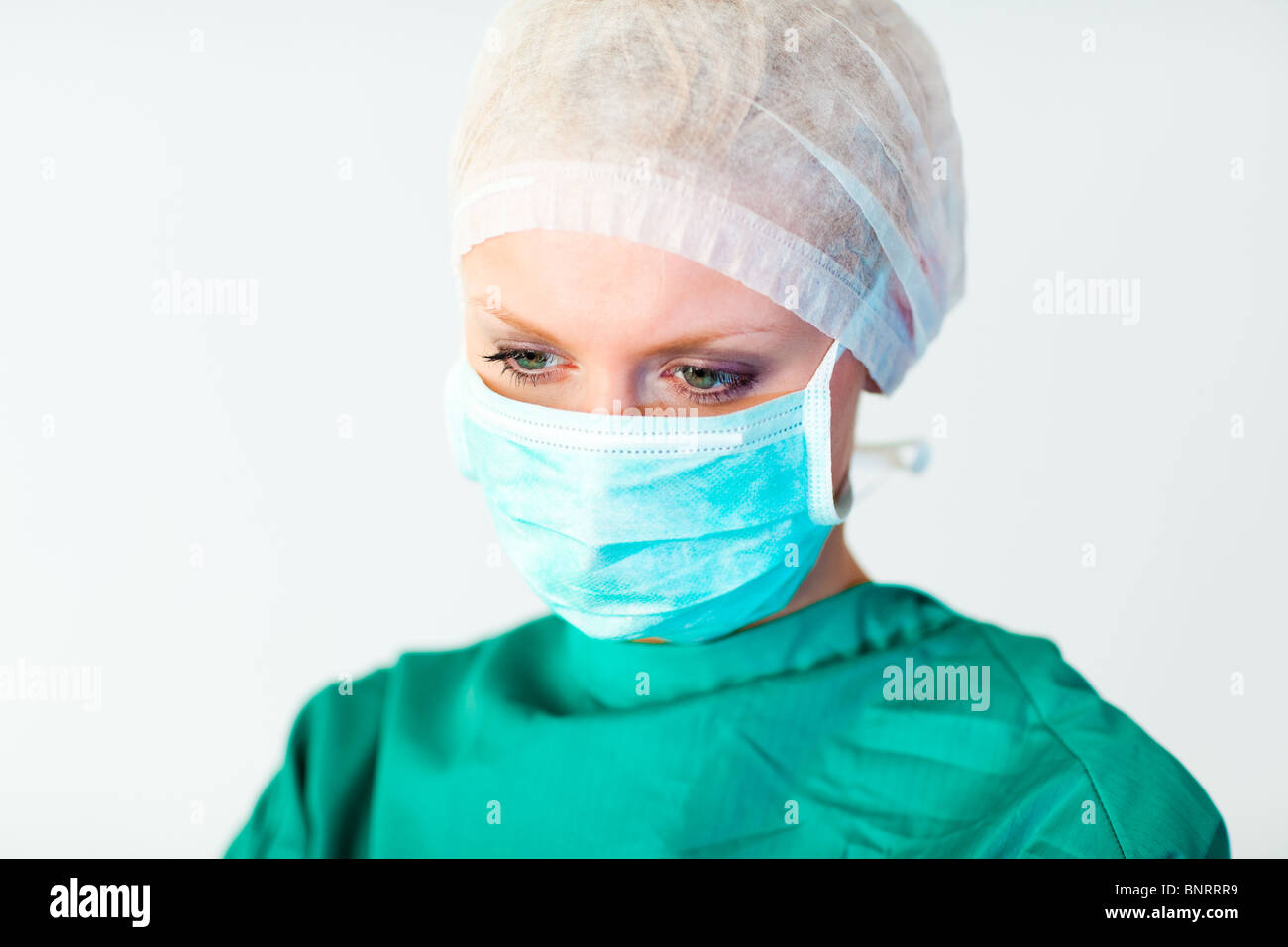 Pretty female surgeon with a mask Stock Photo - Alamy