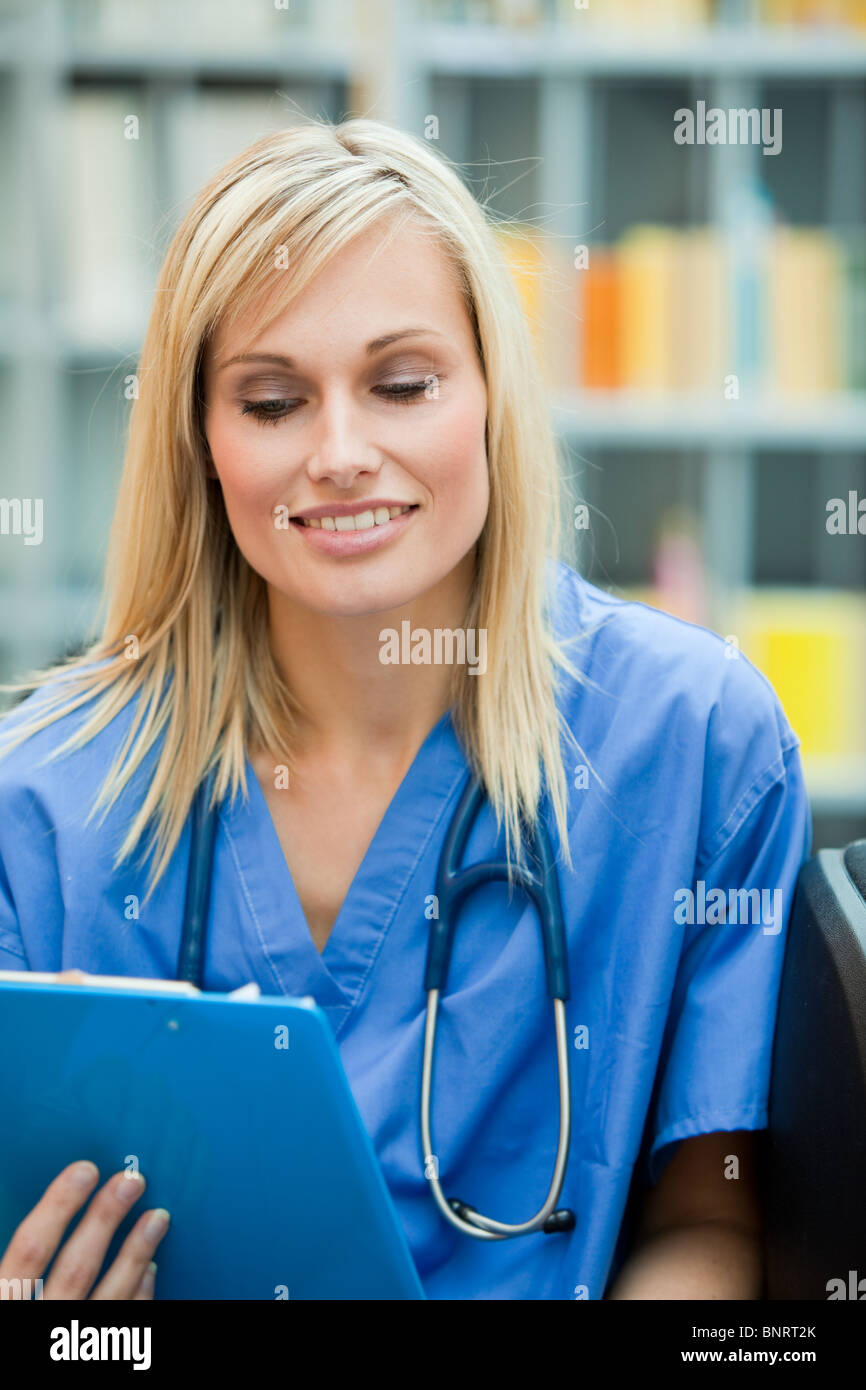 Doctor reading report hi-res stock photography and images - Alamy