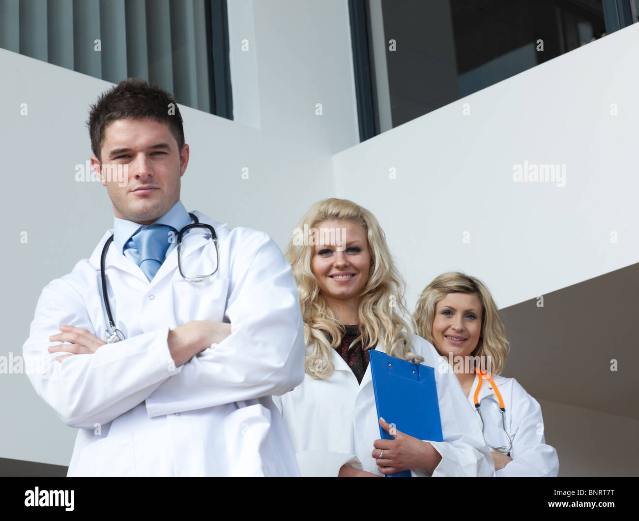 Three doctors in a hospital Stock Photo - Alamy