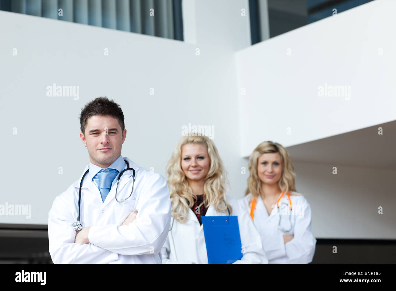 Three doctors in a hospital Stock Photo - Alamy