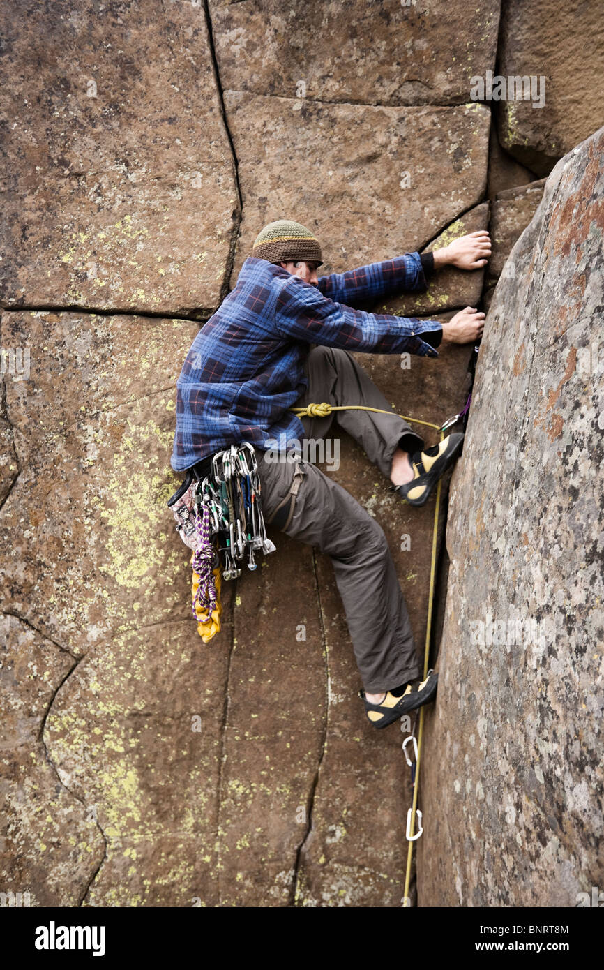 A lead climber uses a crack for leverage Stock Photo - Alamy