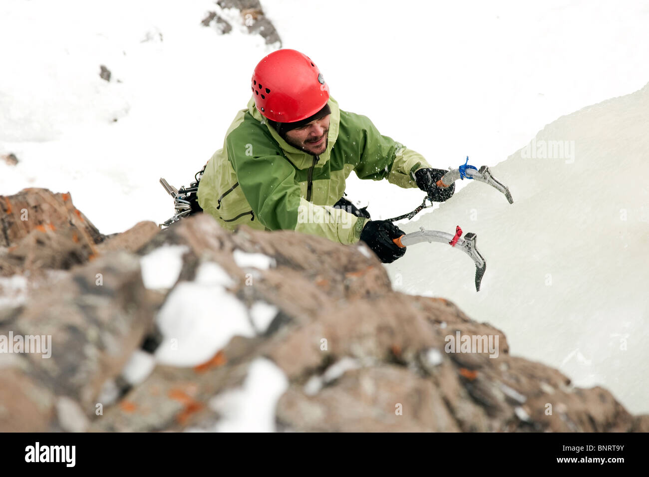 A man ice climbing Stock Photo - Alamy