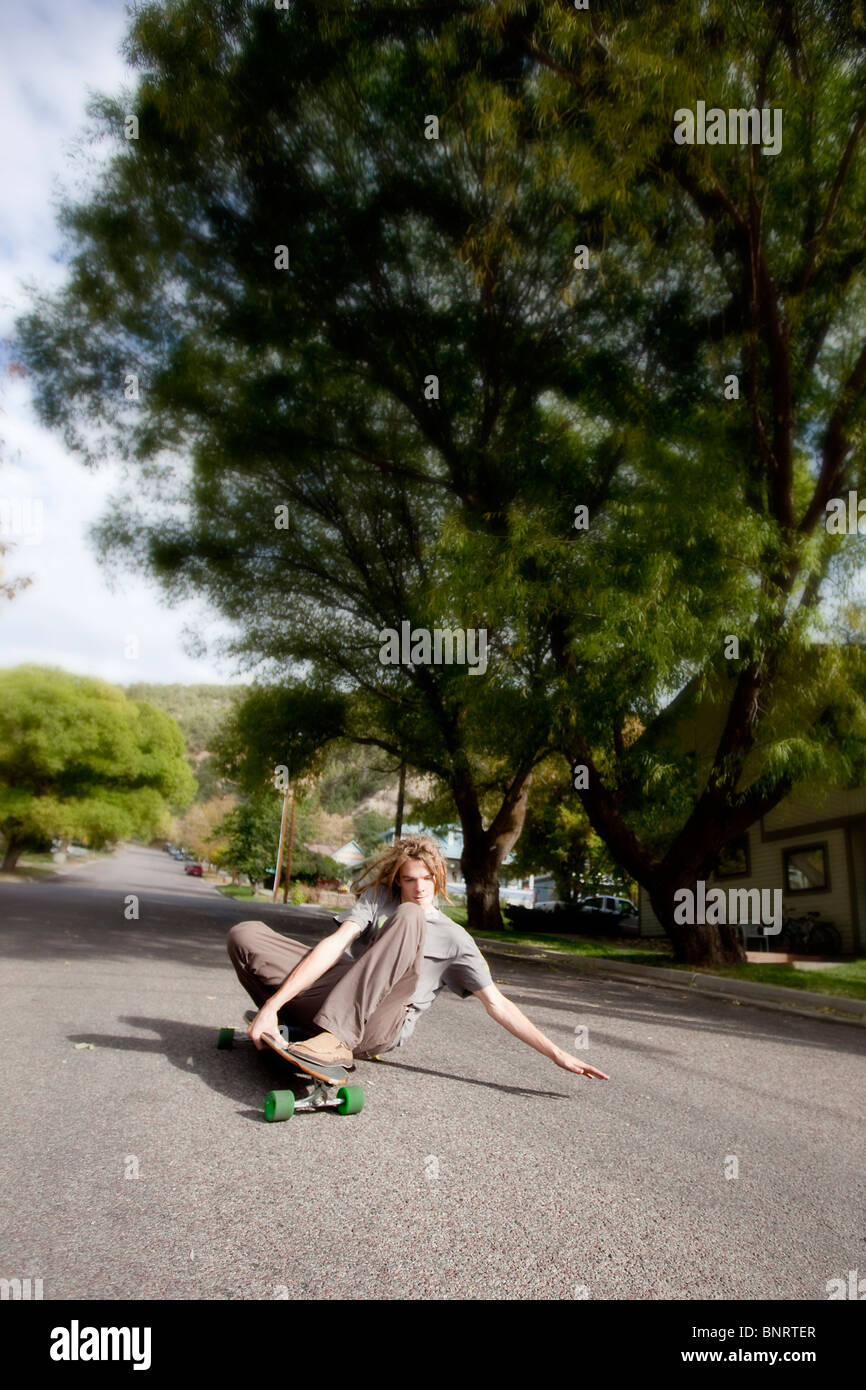 Male longboarder carving in Colorado Stock Photo - Alamy