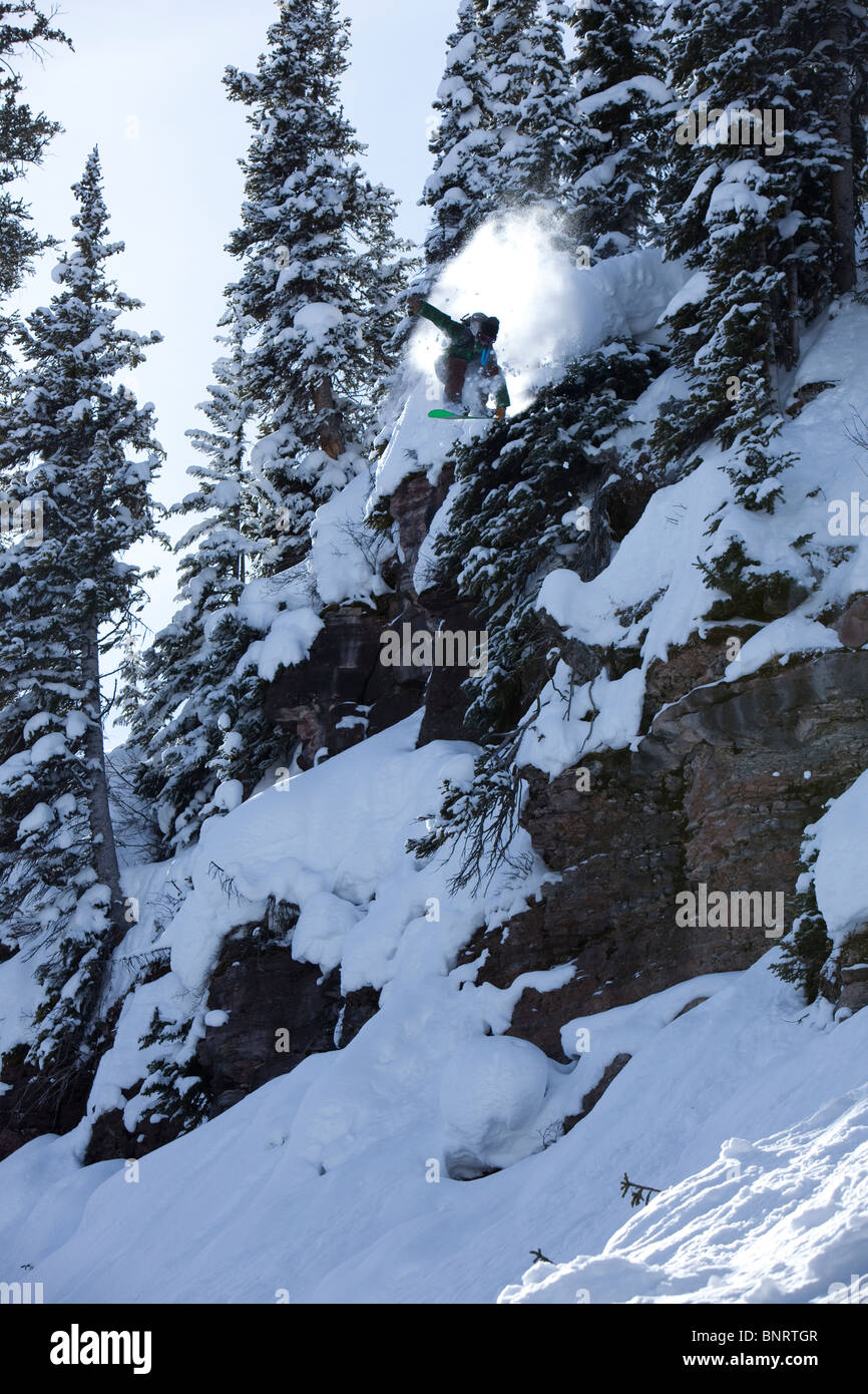 A male snowboarder jumps off cliff in Colorado Stock Photo - Alamy