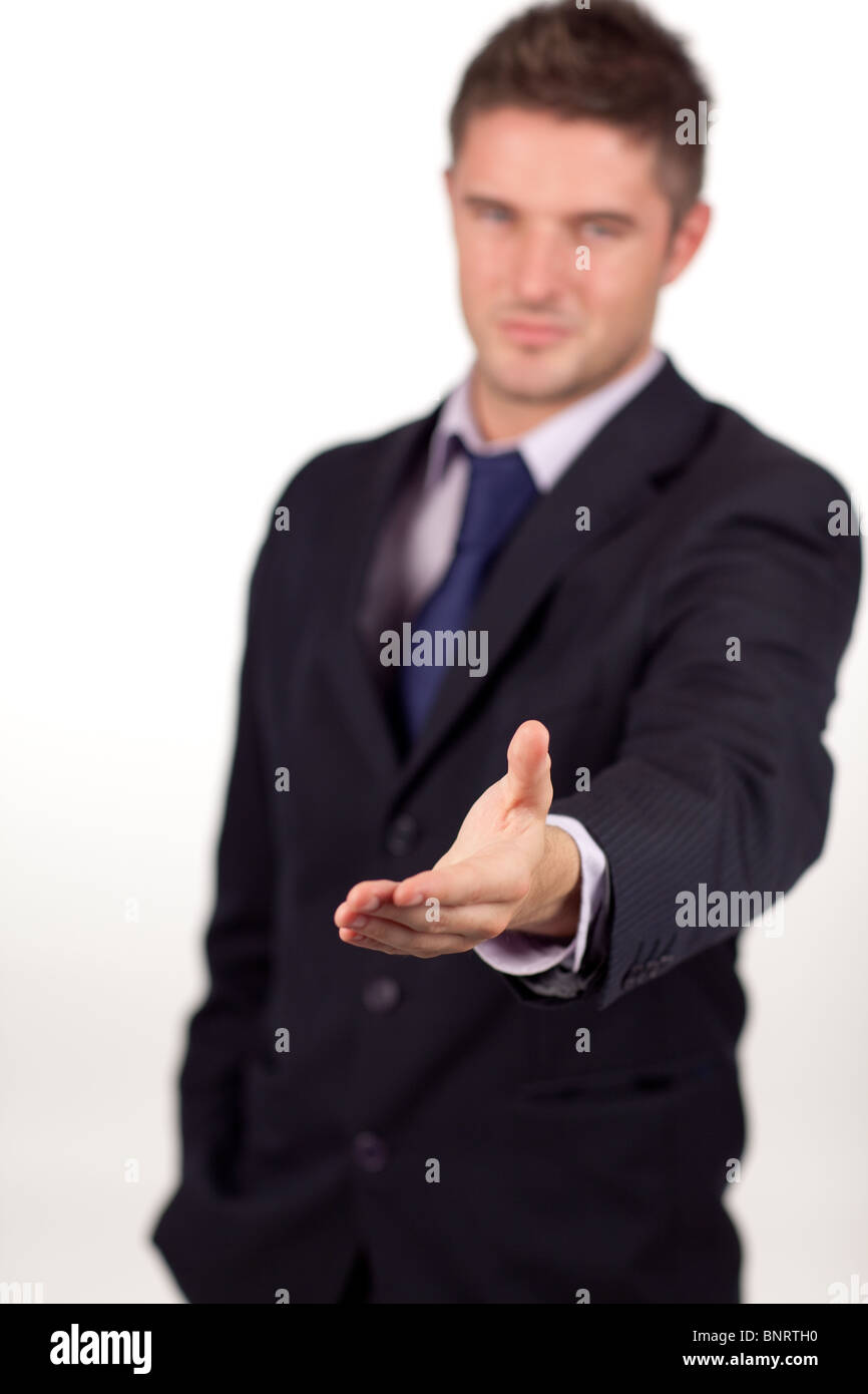businessman showing a handshake to the camera Stock Photo - Alamy