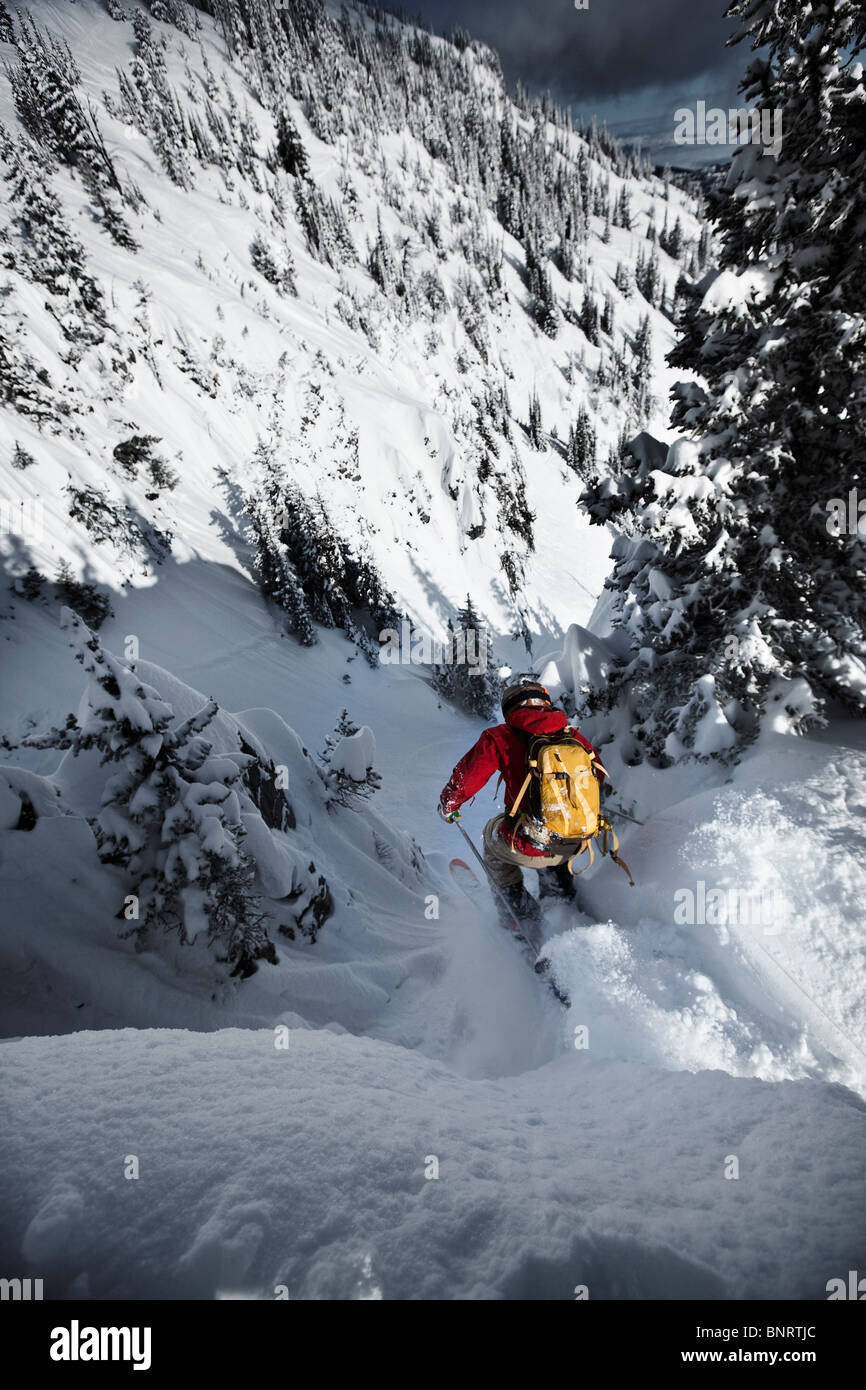 A telemark skier jumping into a narrow chute in Montana Stock Photo - Alamy