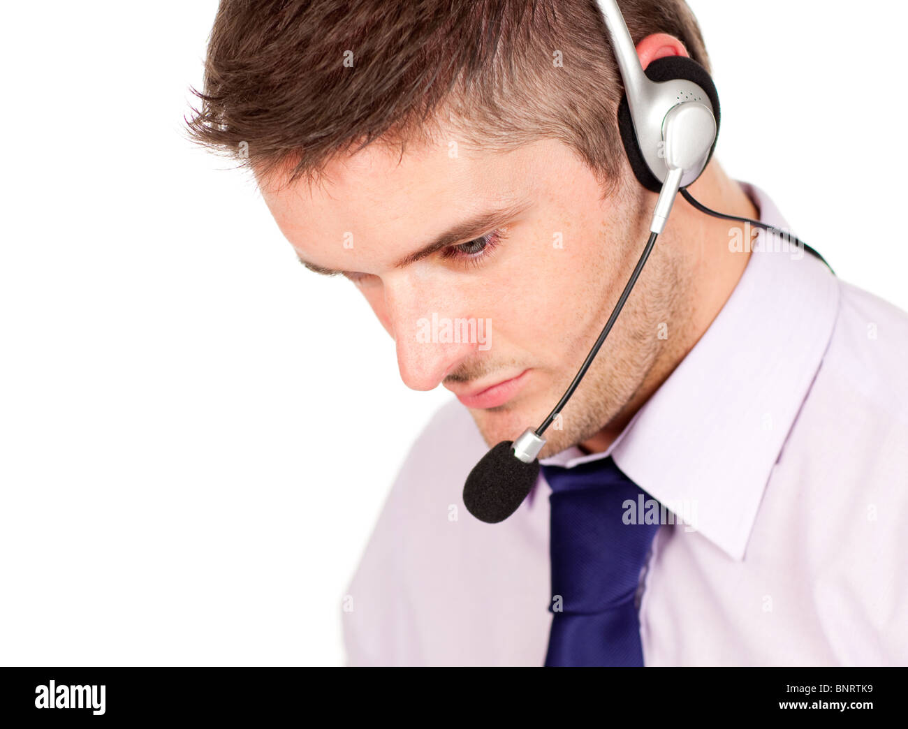 man on a headset looking away from the camera Stock Photo - Alamy