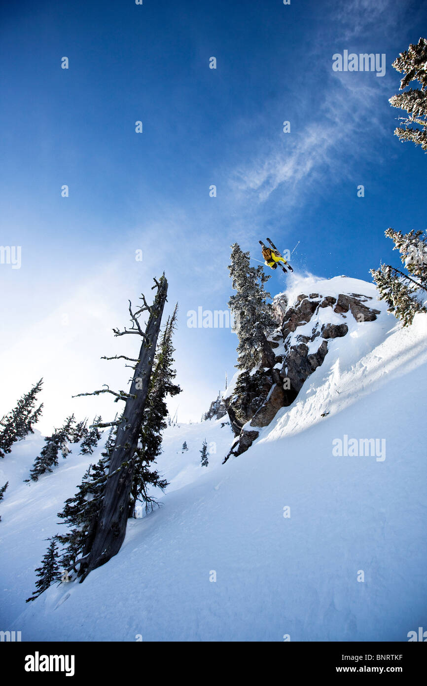 A male telemark skier front flips off a cliff in Montana Stock Photo ...