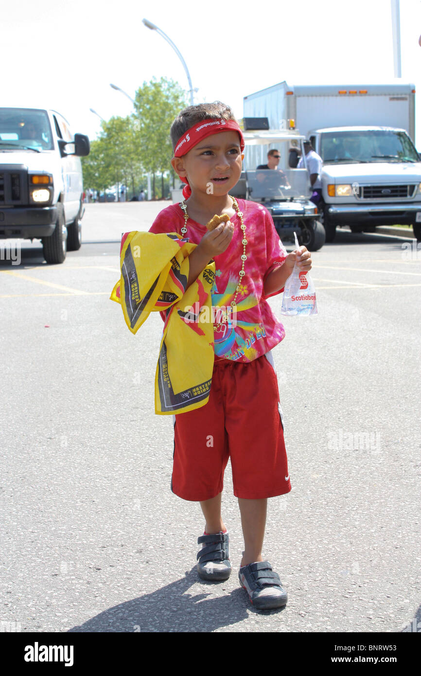 young trinidad boy walking parking lot outdoor Stock Photo - Alamy