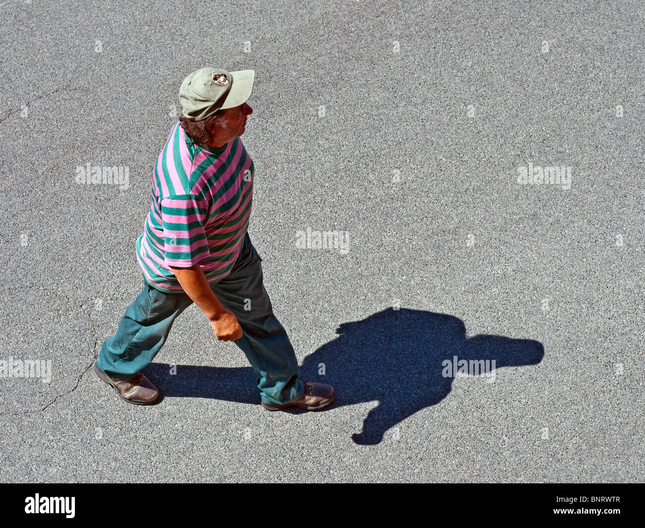 Man striding across road hi-res stock photography and images - Alamy