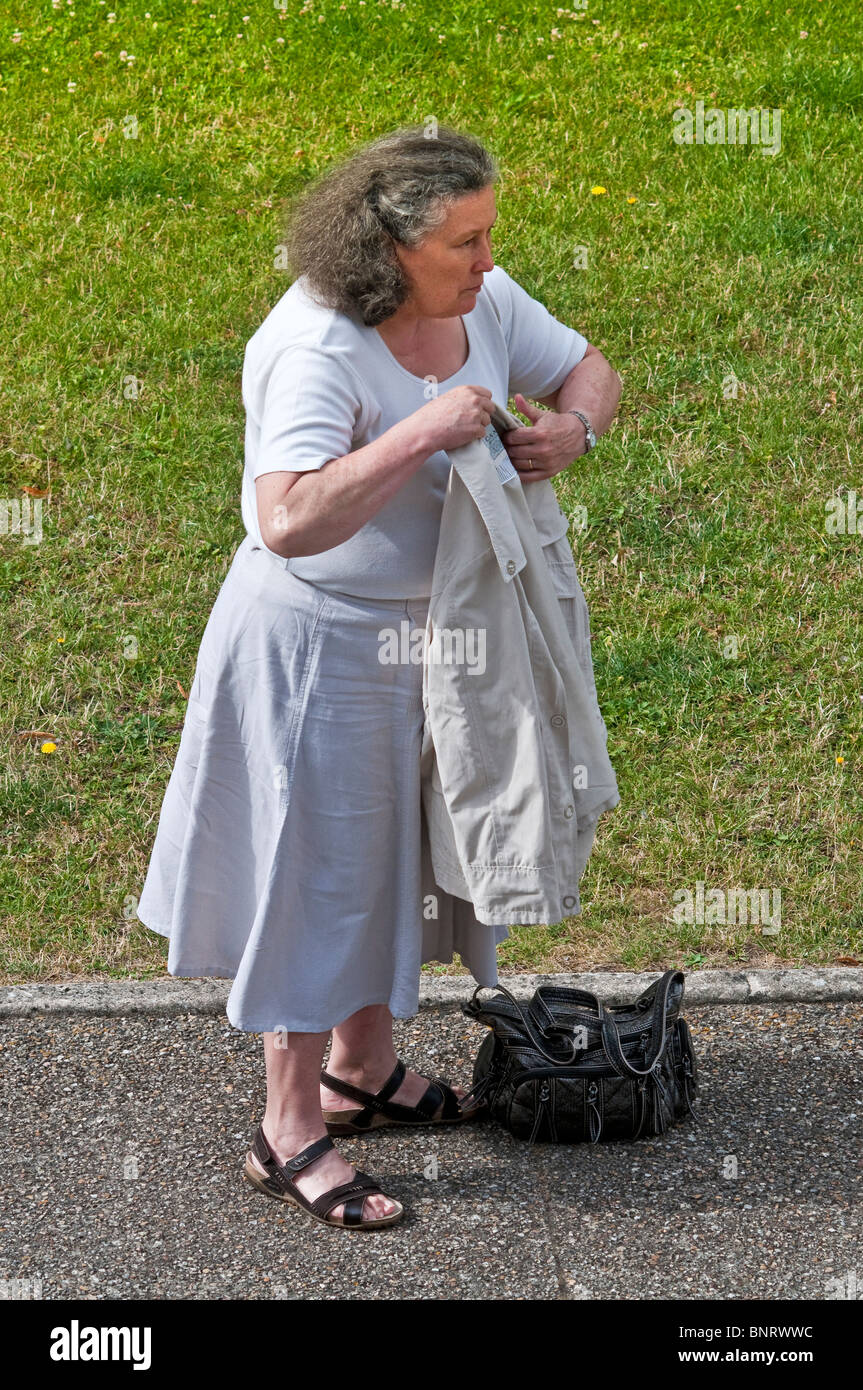 Taking off jacket hi-res stock photography and images - Alamy