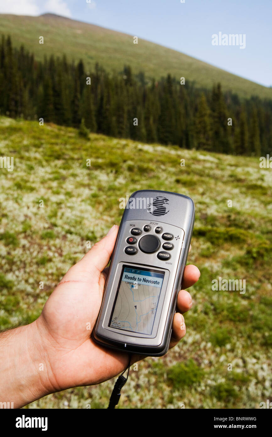 A man checks his location on his GPS unit Stock Photo - Alamy