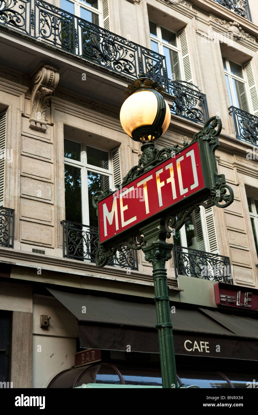 Paris Metro sign outside of Paris cafe Stock Photo - Alamy