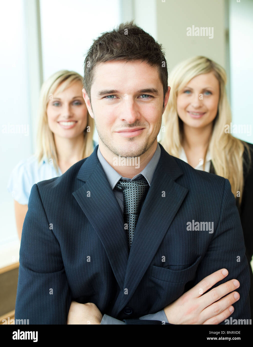 Portrait of three young business people Stock Photo - Alamy